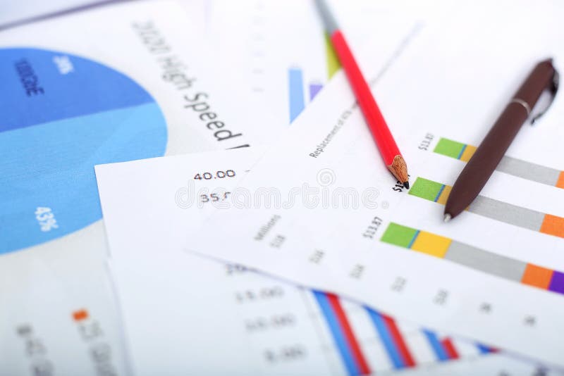 Photo of Pencil and Pen on the Financial Graph Paper Stock Photo ...