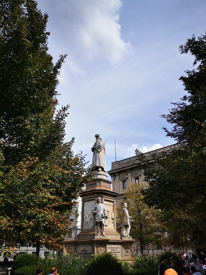 Photo of People Admiring a Statue in a Public Square Stock Photo ...