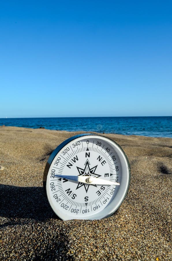 Compass on the Sand Beach stock image. Image of magnetic - 140172323