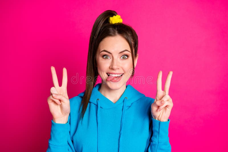 Photo Of Positive Lady Two Hands Fingers Show V Sign Tongue Out