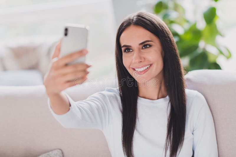 Photo Of Positive Pretty Young Woman Hold Phone Take Selfie Nice Smile