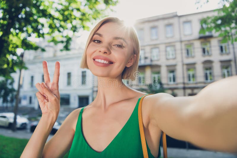 Photo Of Pretty Adorable Young Lady Wear Green Outfit Handbag Smiling