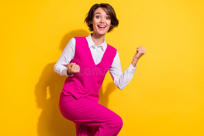 Photo Of Pretty Lucky Young Woman Dressed Pink Suit Rising Fists Empty