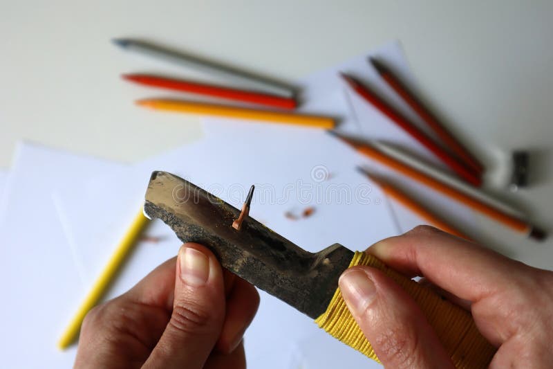 Photo of the Process of Sharpening Pencils with a Clerical Knife. Human ...