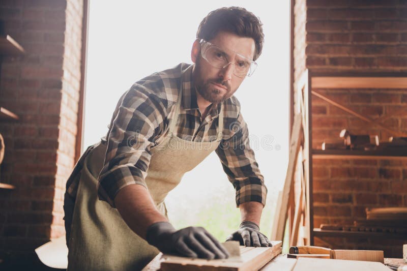Photo of Professional Guy Workman Working with Wood Smooth Plank in ...