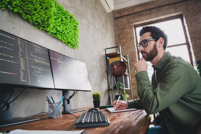 Photo of Professional it Specialist Young Man Write Notebook Computer ...