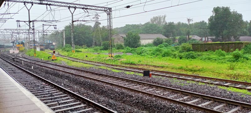 Photo of Railway Track and Station Stock Photo - Image of plants, track ...