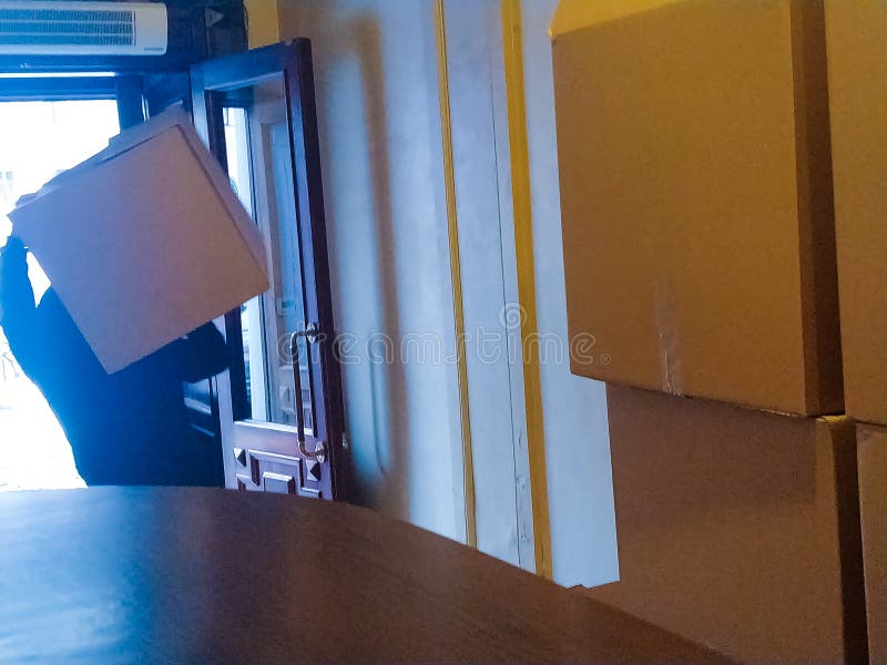 Photo of a Real Move. the Loader Carries Boxes for Moving the Apartment ...