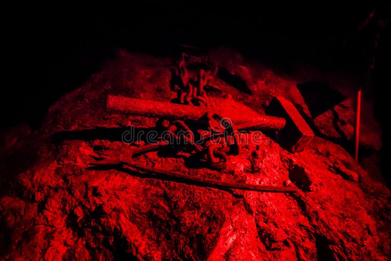 Old Rusty Tools on a Stone in an Abandoned Quarry in Red. Stock Image ...