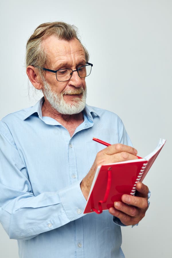 Photo of Retired Old Man Writes Down Emotions in a Notebook Unaltered ...