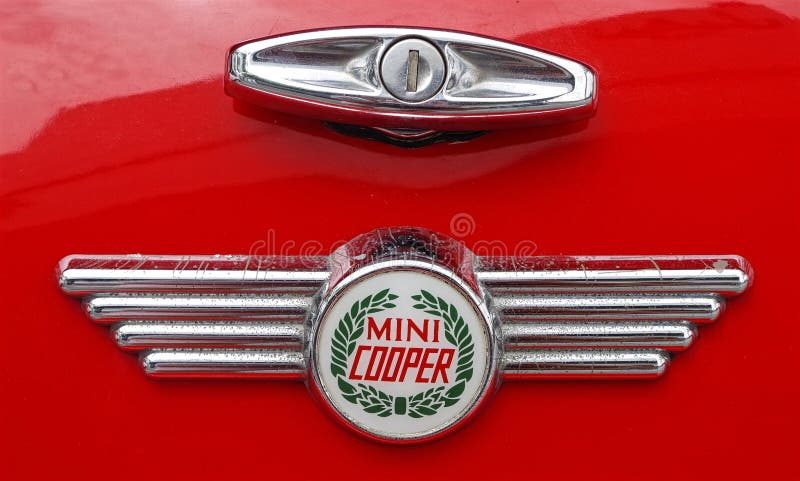 Photo of a Retro Mini Cooper Car Logo Badge on a Red Mini Cooper Car ...