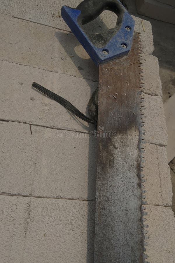 Photo of a Rough Saw Cutting Tool Used To Cut Light Bricks Manually ...