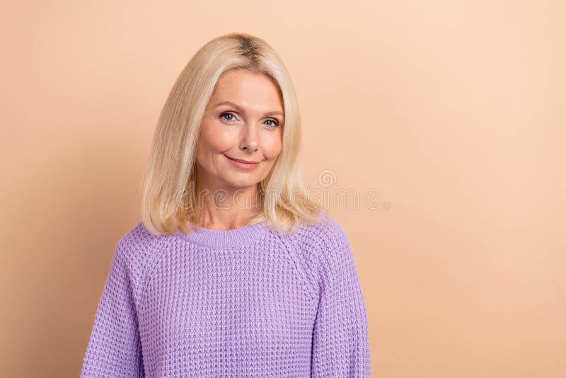 Photo Of Satisfied Glad Pleasant Elderly Lady With Blond Hairdo Wear