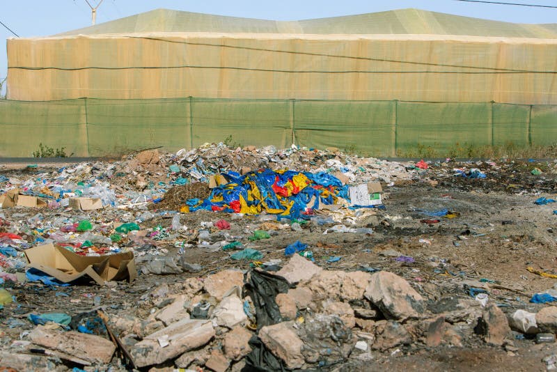 Photo of Scattered Garbage on the Field. the Concept of Waste Disposal ...