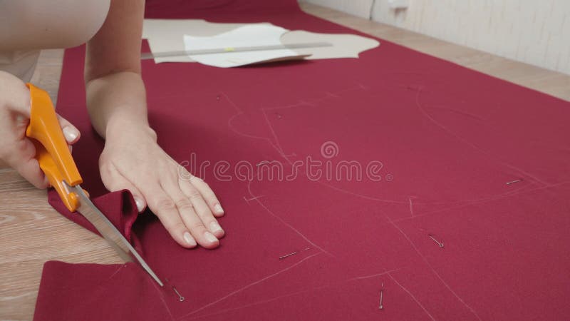 Photo Seamstress Cutting Pattern on Fabric in Workshop Stock Photo ...