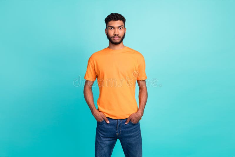 Photo Of Serious Confident Guy Wear Orange T Shirt Standing Hands Arms