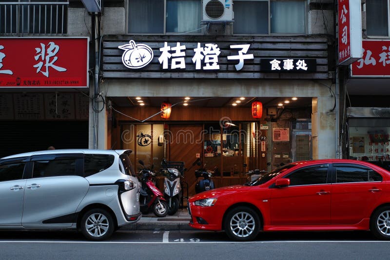 An Image of a Car and Some Motor Bikes in Front of a Restaurant ...