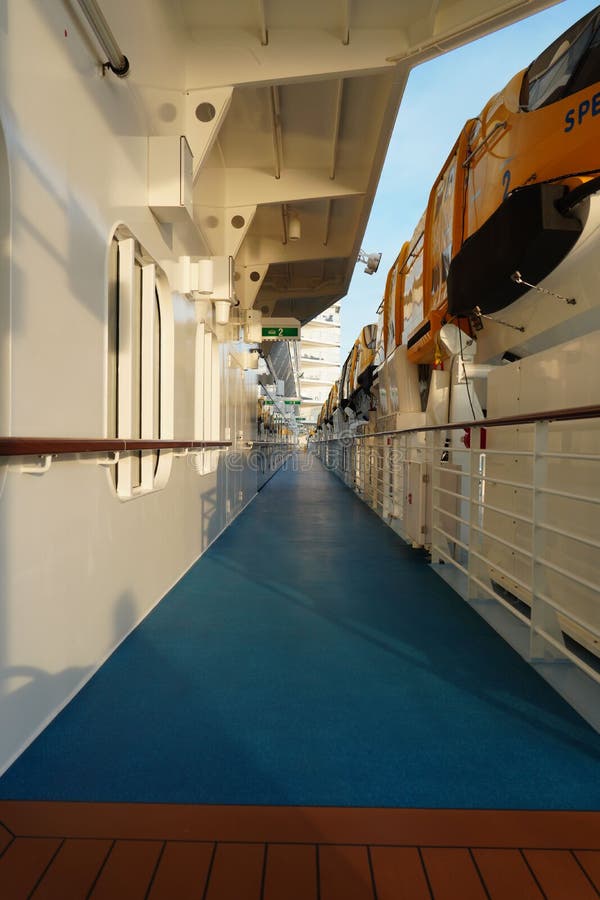 A Photo of a Ship Corridor with Blue Flooring Stock Image - Image of ...