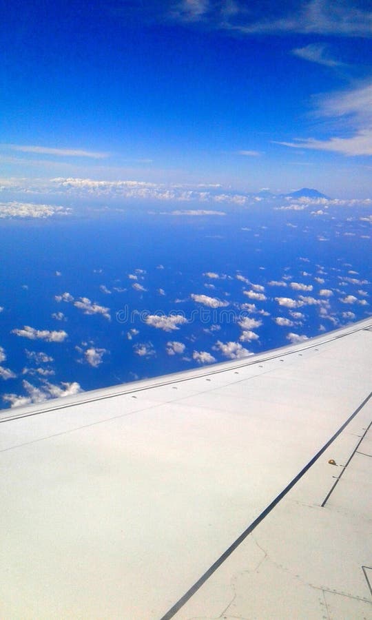 Photo of the Sky and Clouds from Inside the Plane at High Altitude ...