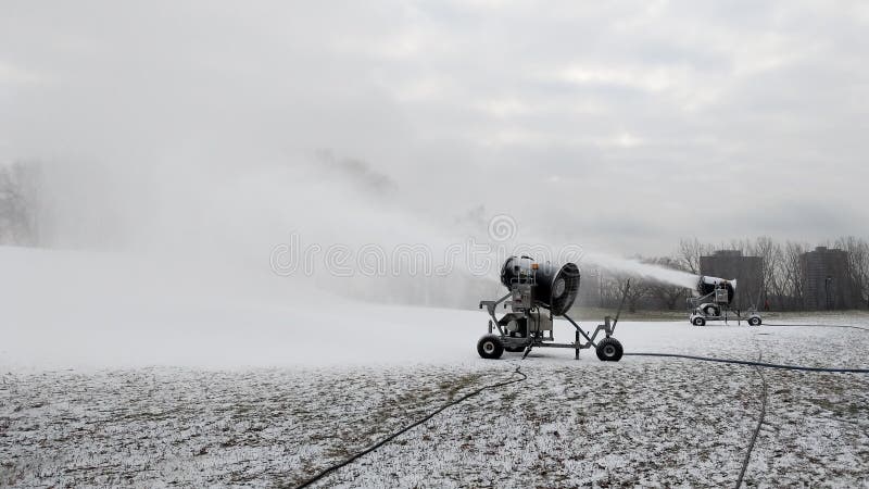 Artificial Snow Production on a Field. Concept of Snow Cannon, Climate ...