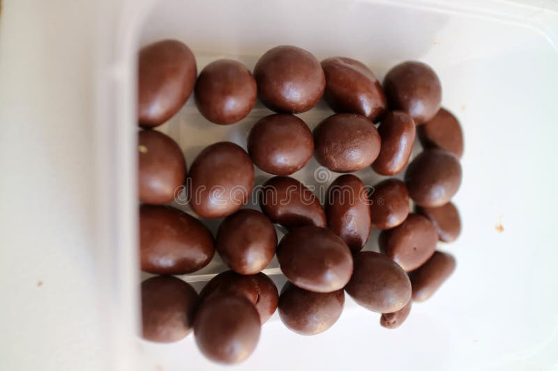 Photo of Some Dark Brown Chocolate Granules, in Plastic Container Stock ...