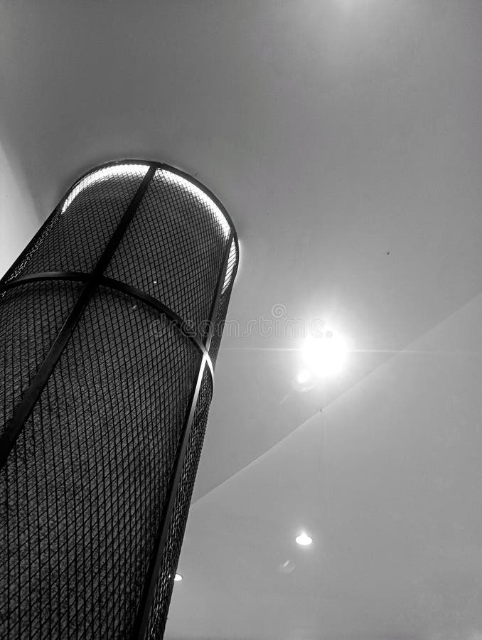 A Photo of a Structural Pole with Wire Mesh Surrounding the Pole in ...