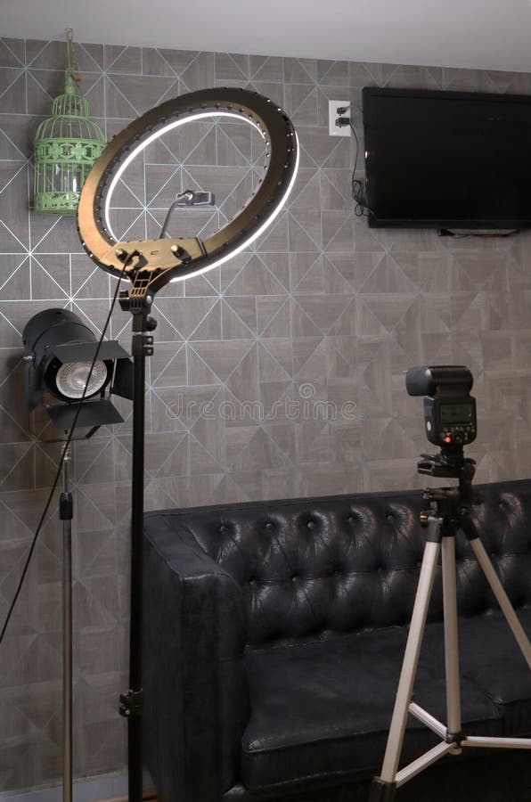 Photo Studio with a Flash on a Tripod and Other Lights Ready for a ...