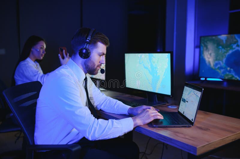 Photo of a Successful Dispatcher Working on a Computer in the Office ...