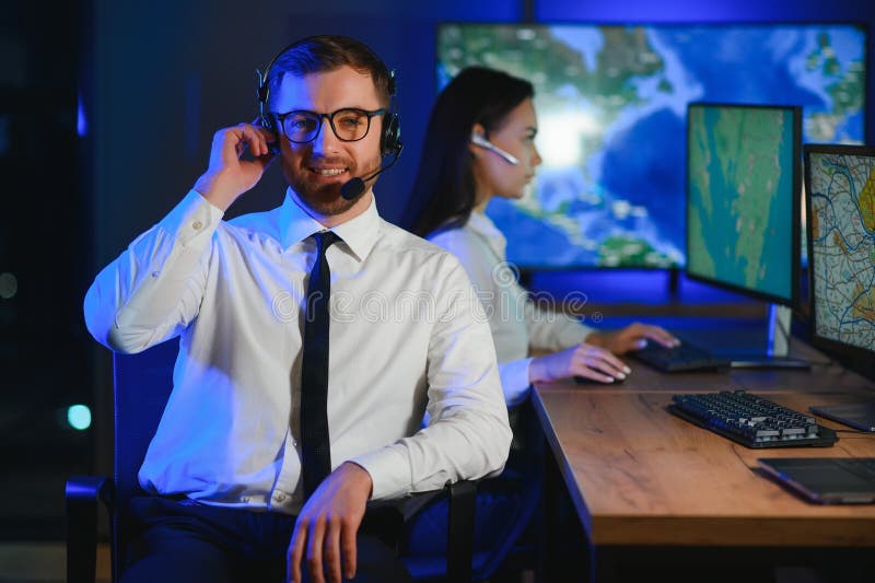 Photo of a Successful Dispatcher Working on a Computer in the Office ...