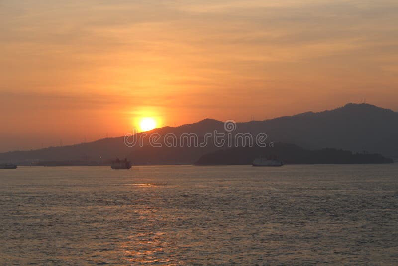 A Photo of the Sun Setting Over the Horizon Stock Photo - Image of ...