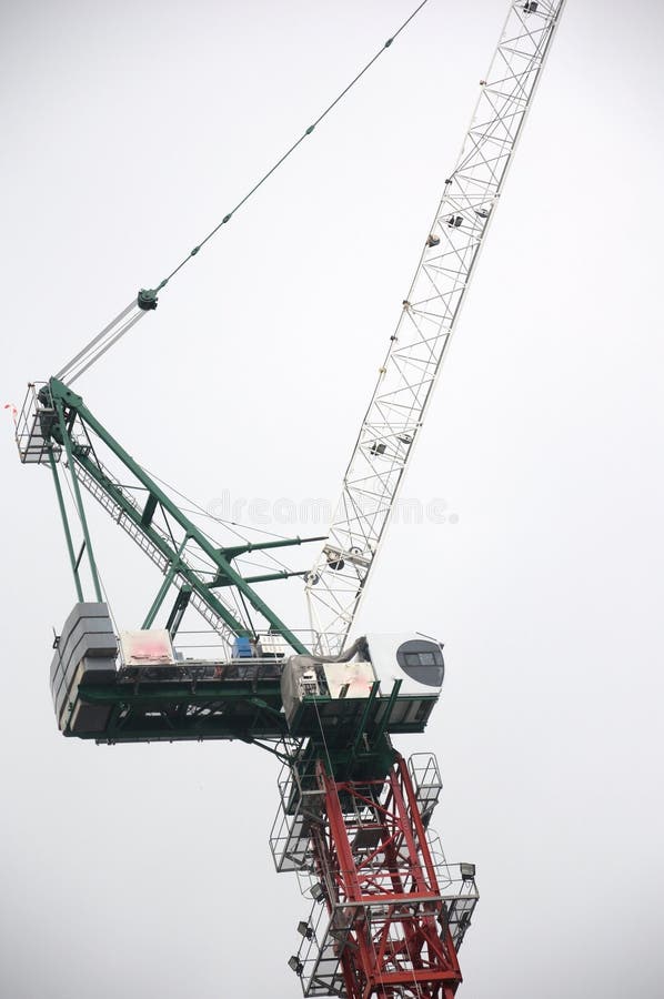 A Construction Fixed Tower Crane Hoist at a Construction Side Against a ...
