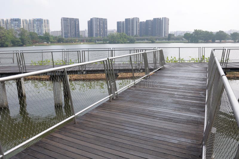 The Intersection of Two Rows of Boardwalks on a Lake with Buildings ...