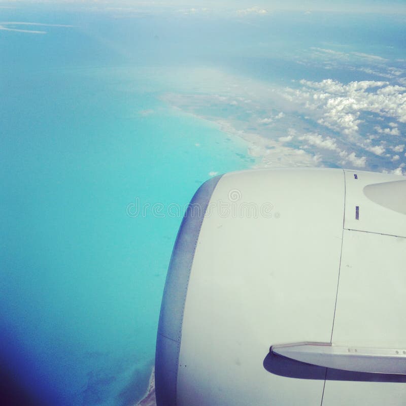Passenger View through the Window of a Jet Plane Showing Sky, Clouds ...
