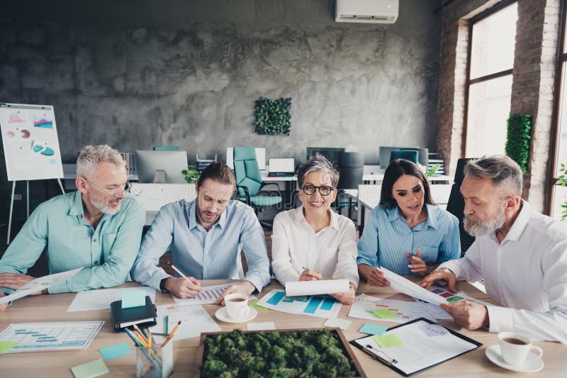 Photo of Teamwork Startup Partners Sit Table People Working Together ...