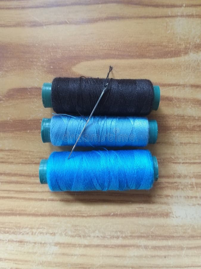 Photo of Three Sewing Threads and One Needle Stock Image - Image of ...