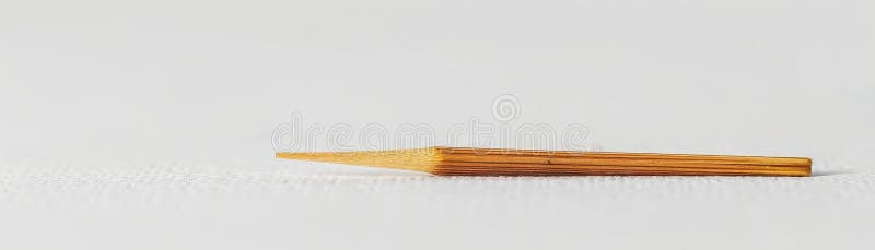 Photo of a Toothpick on a White Background Highlighting Its Sharp Tip ...