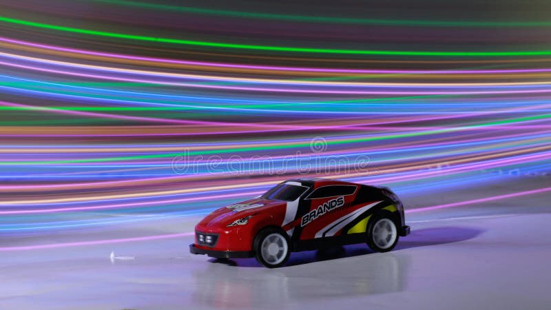 Photo of a Toy Car Using the Light Trails Photo Technique at Night ...
