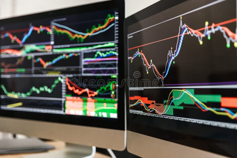 Photo of Two Computer Screens with Digital Information Standing on ...