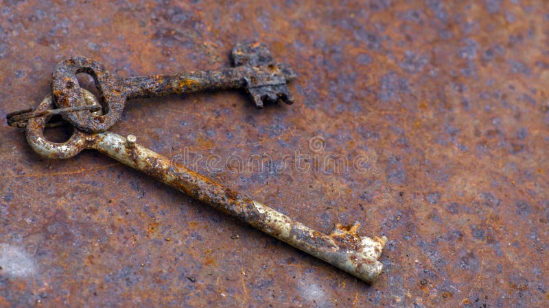 Two Old Rusty Keys on Ring Shot on Steel Textured Background. Stock ...