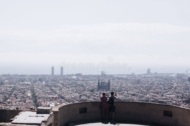 Photo Of Two People At The Rooftop Stock Image - Image of city, tower ...