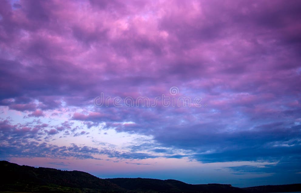 Photo of a Violet Sunset with Clouds Stock Image - Image of beautiful ...