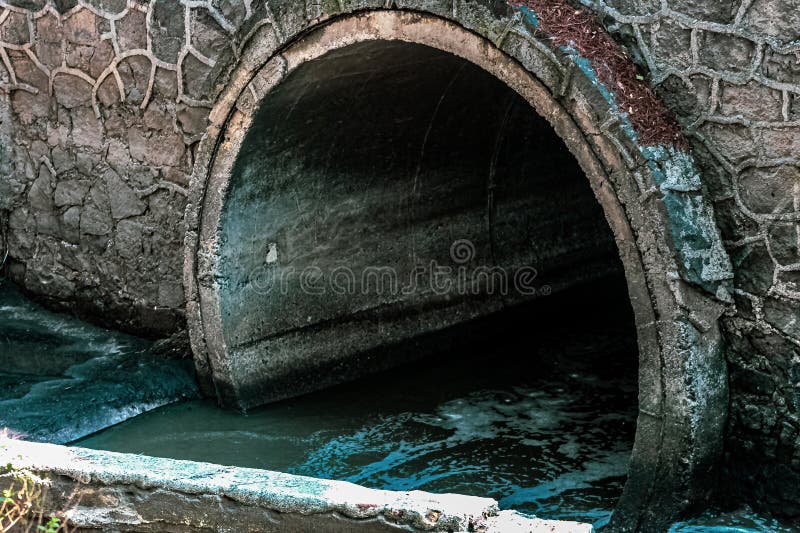 Photo of Waste Water Sewage from a Pipe into the River Stock Photo ...