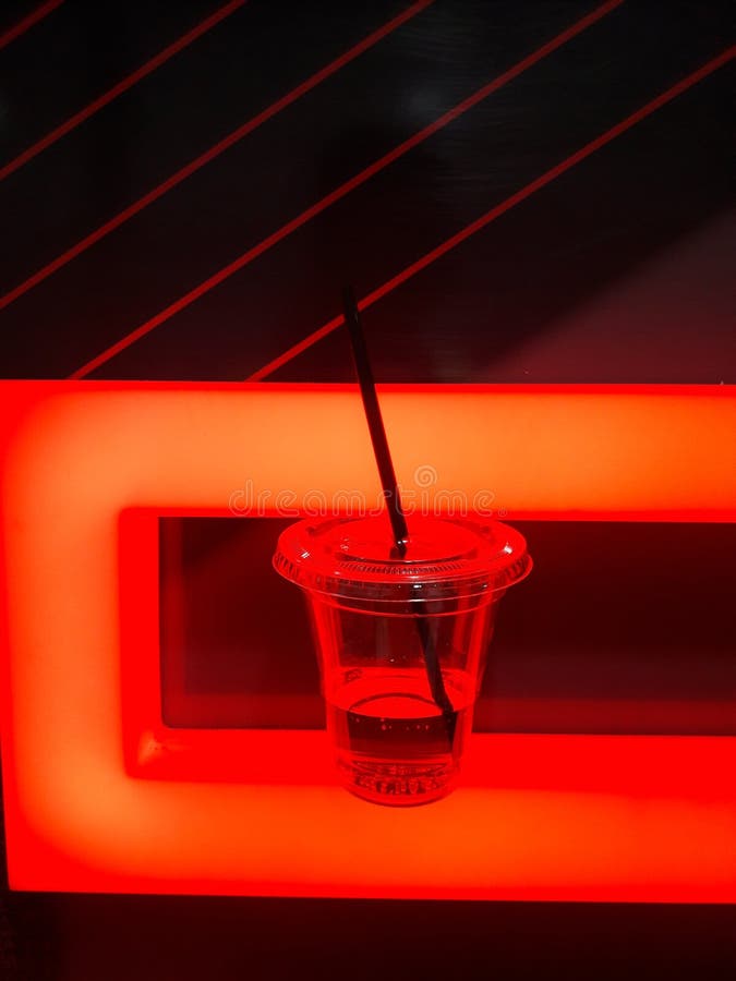 Photo of Water in a Clear Plastic Cup, with a Red LED Light Background ...