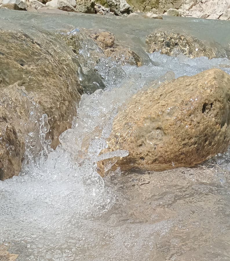 Photo of Water Flowing between Rocks in a River Stock Photo - Image of ...