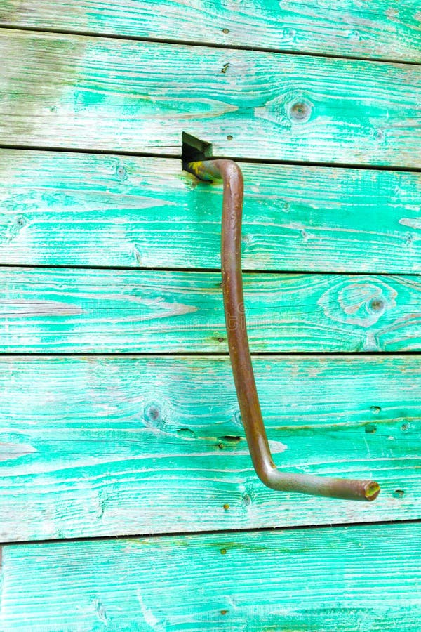 A Photo of a Well Hand Crank on a Green Wood Stock Photo - Image of ...
