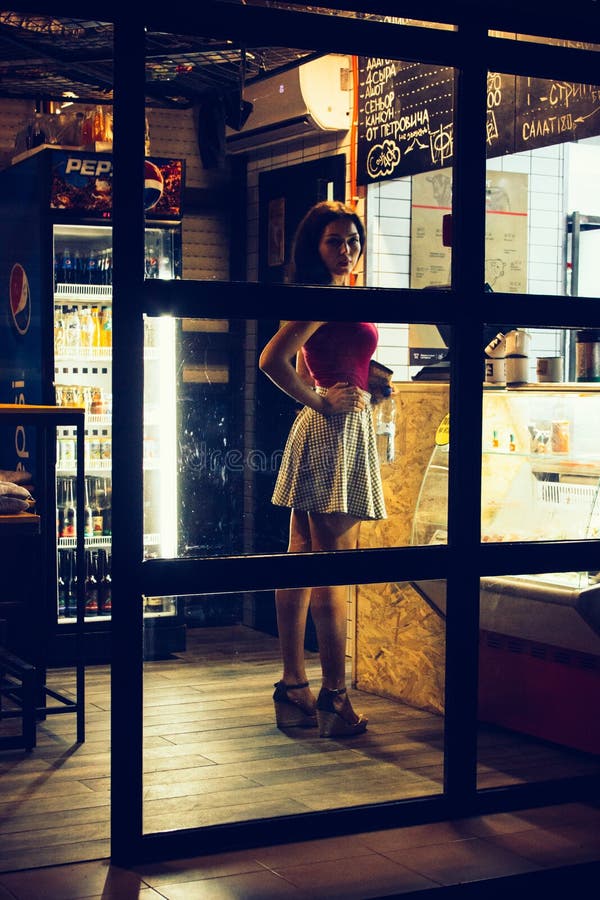 Photo of a Woman Standing in Front of the Counter Stock Image - Image ...