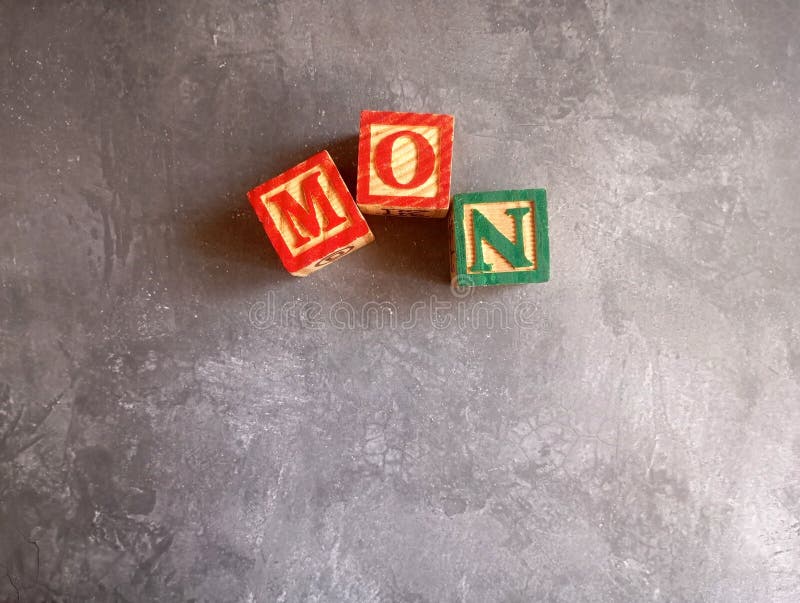 A Photo of a Wooden Block with the Words Monday Written on it, Styled ...