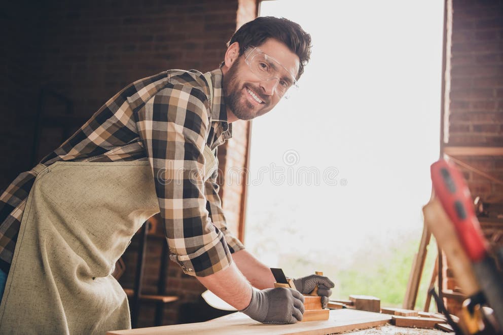 Photo of Workman Wood Worker Guy Using Tool for Working with Plank in ...