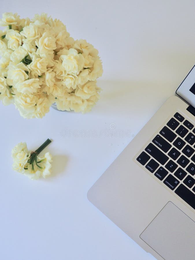Photo of Yellow Flower Bouquet and White and Black Laptop Computer ...