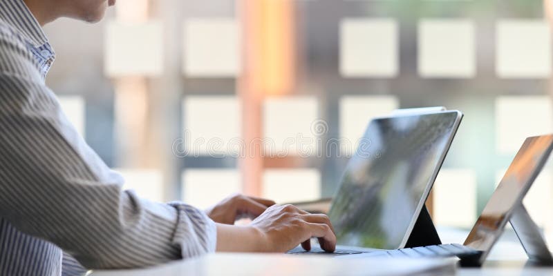 Photo of Young Businessman Typing on Computer Tablet with Keyboard Case ...